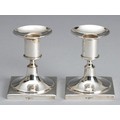 A PAIR OF RUSSIAN SILVER CANDLESTICKS