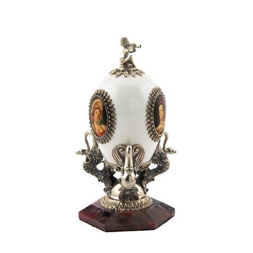A RUSSIAN STYLE METAMORPHIC SILVER-GILT EGG