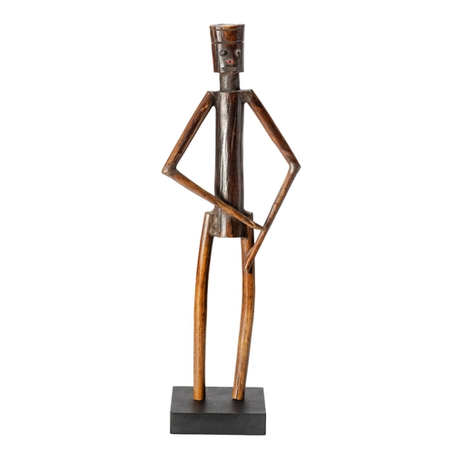 A WOODEN COLON FIGURE, TANZANIA