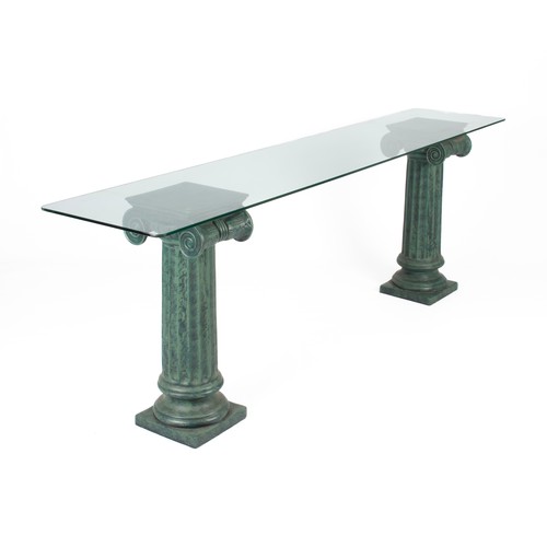 A GLASS-TOPPED CONSOLE TABLE