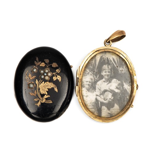 A SEED PEARL AND ENAMELLED LOCKET