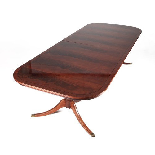 A GORDON FRASER MAHOGANY EXTENDING DINING TABLE