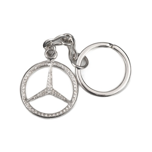 A GOLD AND NATURAL DIAMOND KEY CHAIN