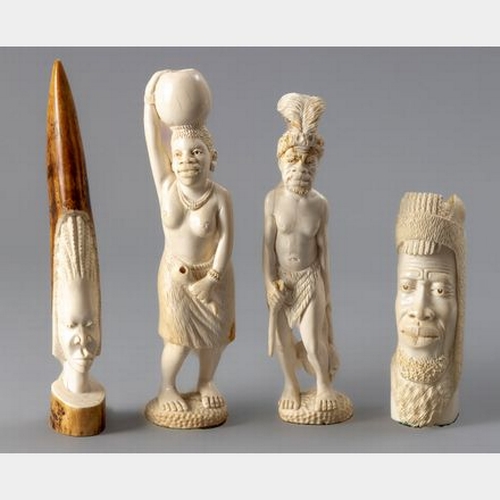FOUR CARVED BONE FIGURES