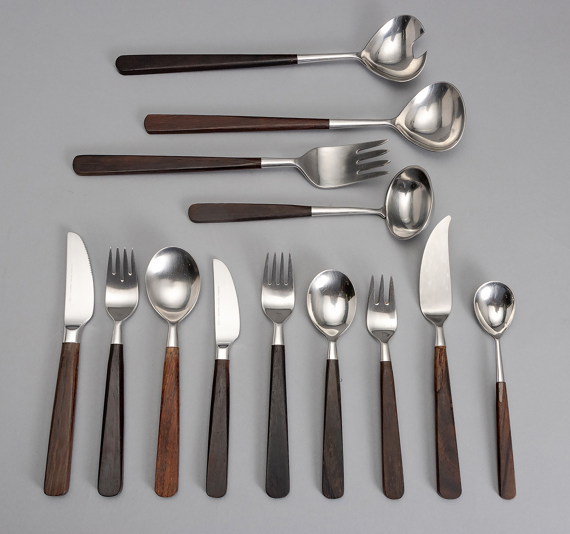 A SET OF HACKMAN FINLAND ROSEWOOD AND STAINLESS STEEL CUTLERY, CIRCA 1960