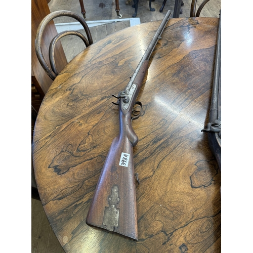 A 19th century twin barrelled percussion musket