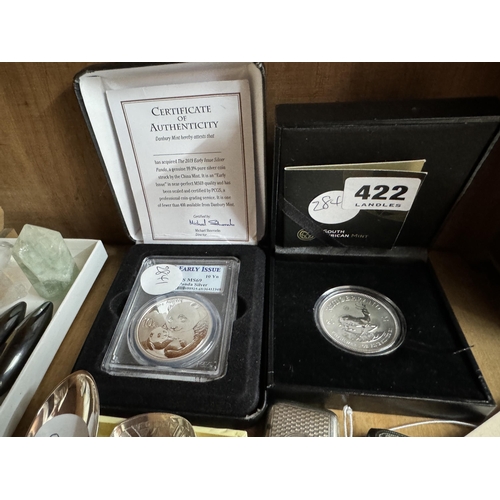 2 commemorative silver coins - an early issue panda and a South African ...