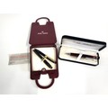 A Pierre Cardin, a light reflected mottled deep red ballpoint, also ...