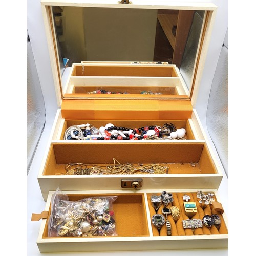 A cream jewellery box with hinge lid and lock (no key), with a golden ...