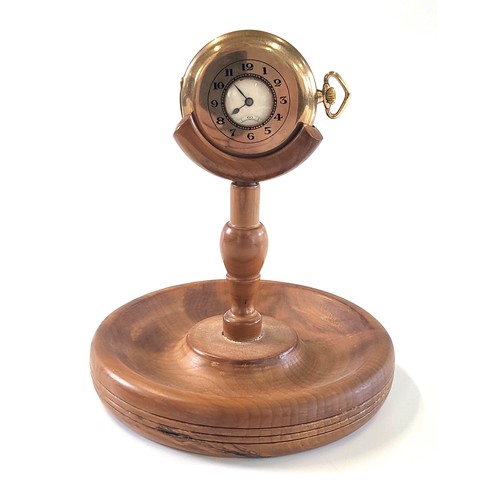 A turned wooden fob watch stand and a 9ct rose gold fob watch (watch ...