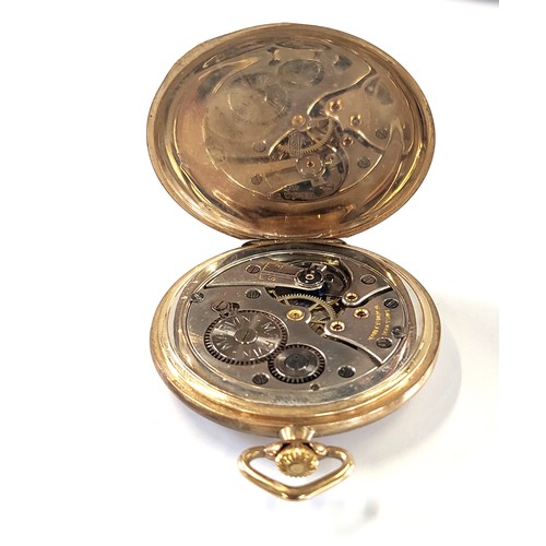 A turned wooden fob watch stand and a 9ct rose gold fob watch (watch ...