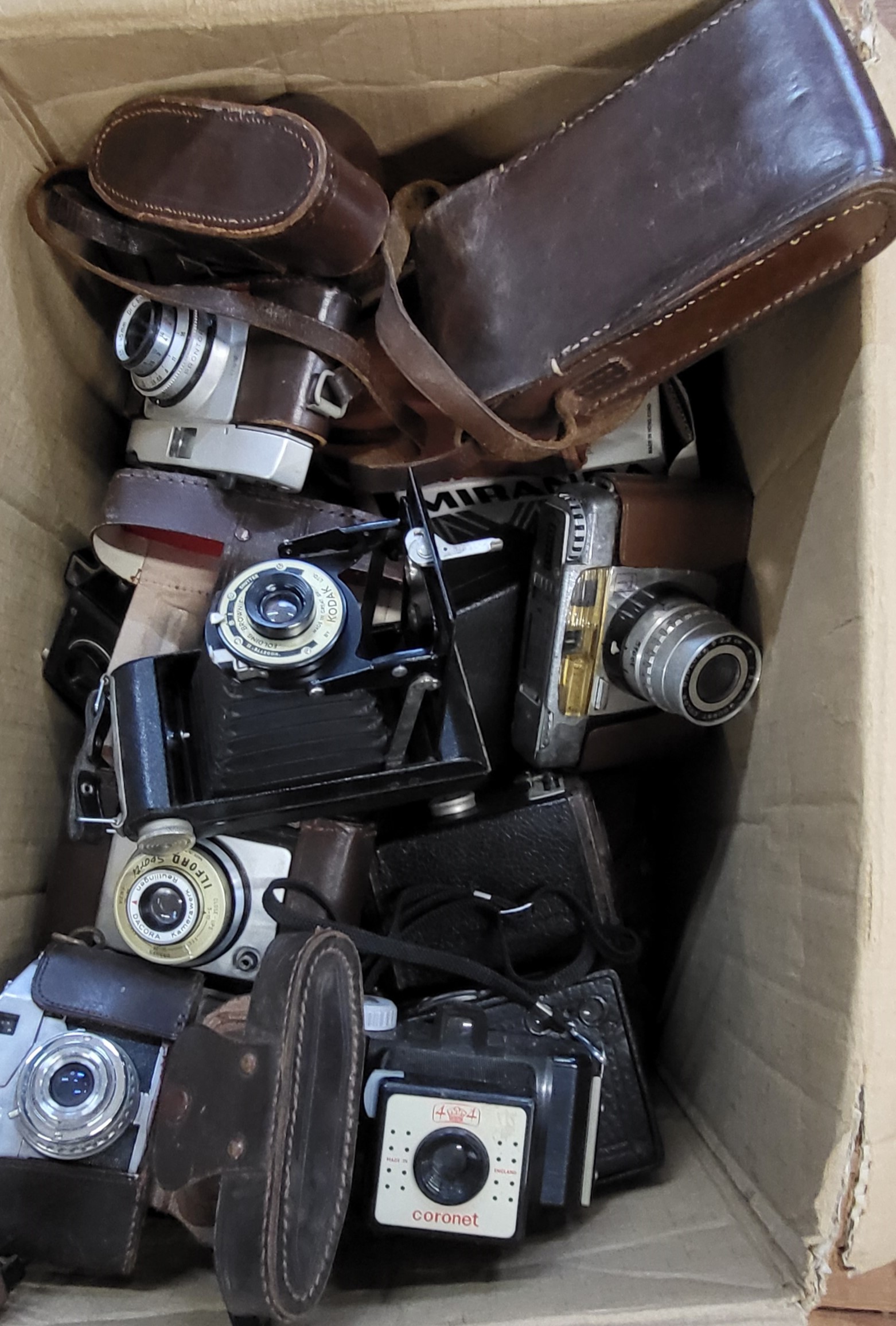 A large box containing twenty-eight vintage cameras including Kodak ...