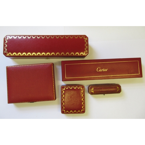 Five various Cartier red leather jewellery boxes