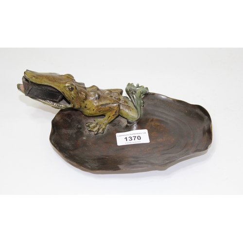 Green and brown patinated bronze match striker in the form of a ...