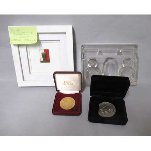 Two cased medallions, glass desk stand and a framed Polish enamel ...