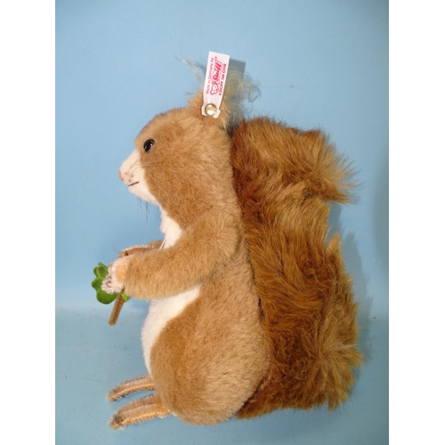 Steiff, a musical squirrel with button, cloth label and one small card ...