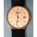 A gentleman's 9ct gold Rotary Elite quartz wrist watch, the gilt dial ...