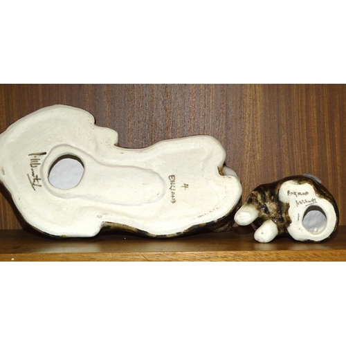 A Winstanley tabby cat with glass eyes, in a recumbent pose, signed and ...