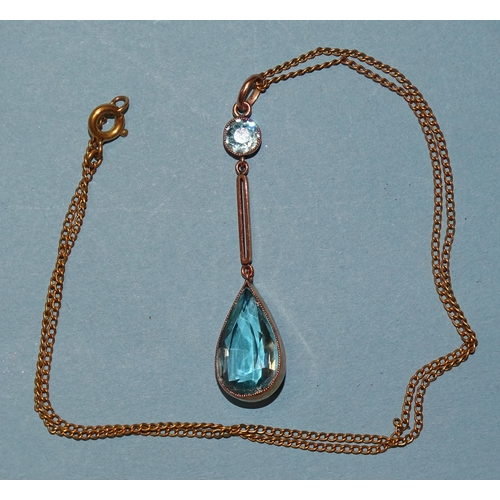 An Edwardian pendant millegrain-set a pendeloque-cut blue stone below a ...
