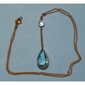 An Edwardian pendant millegrain-set a pendeloque-cut blue stone below a ...