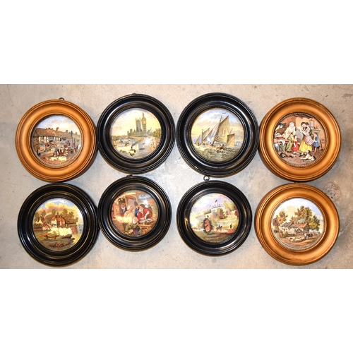A collection of eight Staffordshire framed Prattware pot lids: 'Thames ...
