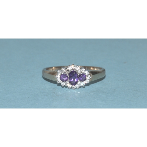 A 9ct yellow gold ring set amethyst and cubic zirconia cluster, size Q½ ...