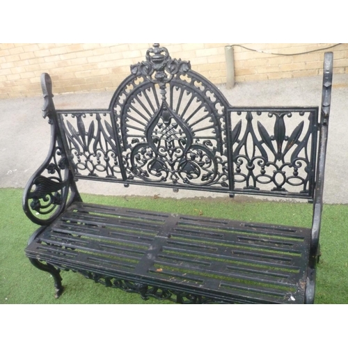 Ornate cast metal garden bench with arched back, eagle wing arms and ...
