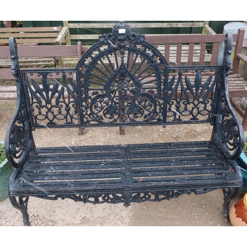 Ornate cast metal garden bench with arched back, eagle wing arms and ...