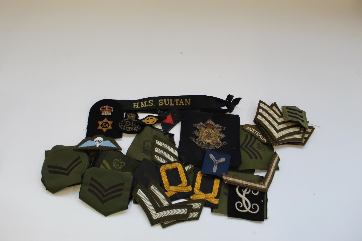 Large collection of cloth insignia - auctions & price archive