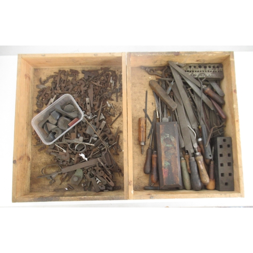 Collection of gun tools and parts in 2 wood drawers