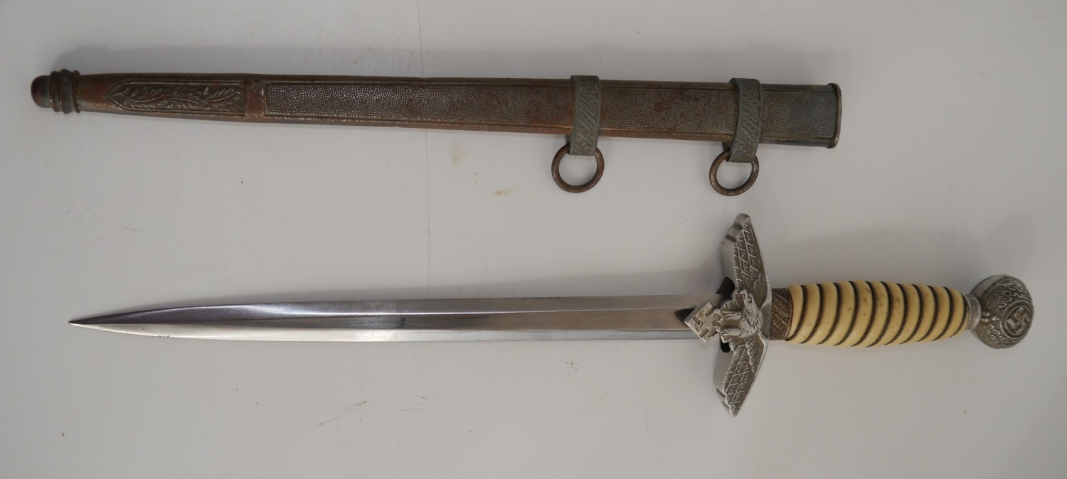 Two German wartime military daggers, with eagles near crossguard, both ...
