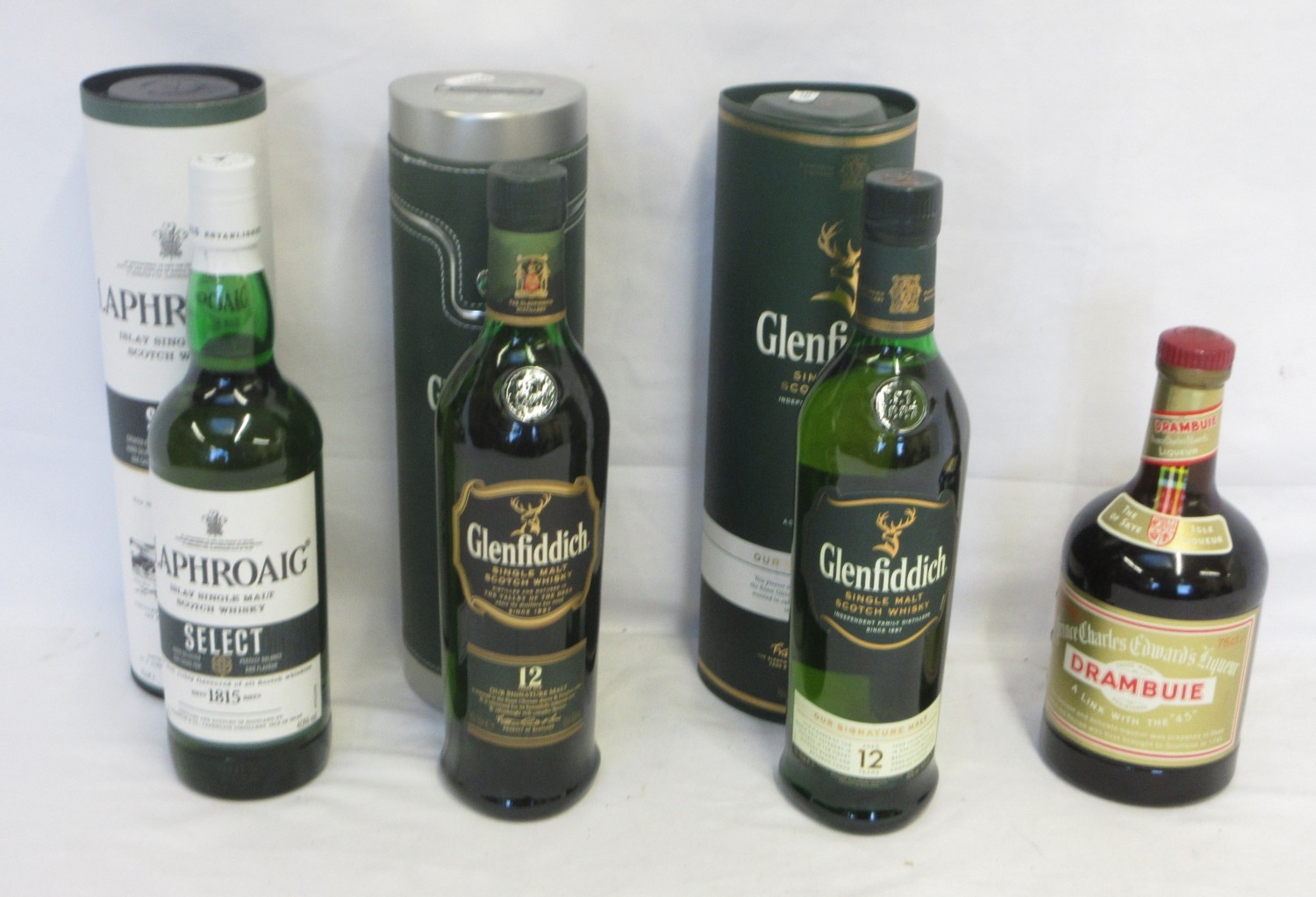 Laphroaig Select 70cl 40%vol, 2 Glenfiddich 70cl 40%vol and a Drambuie 75cl 40%vol Bradley's Shippi