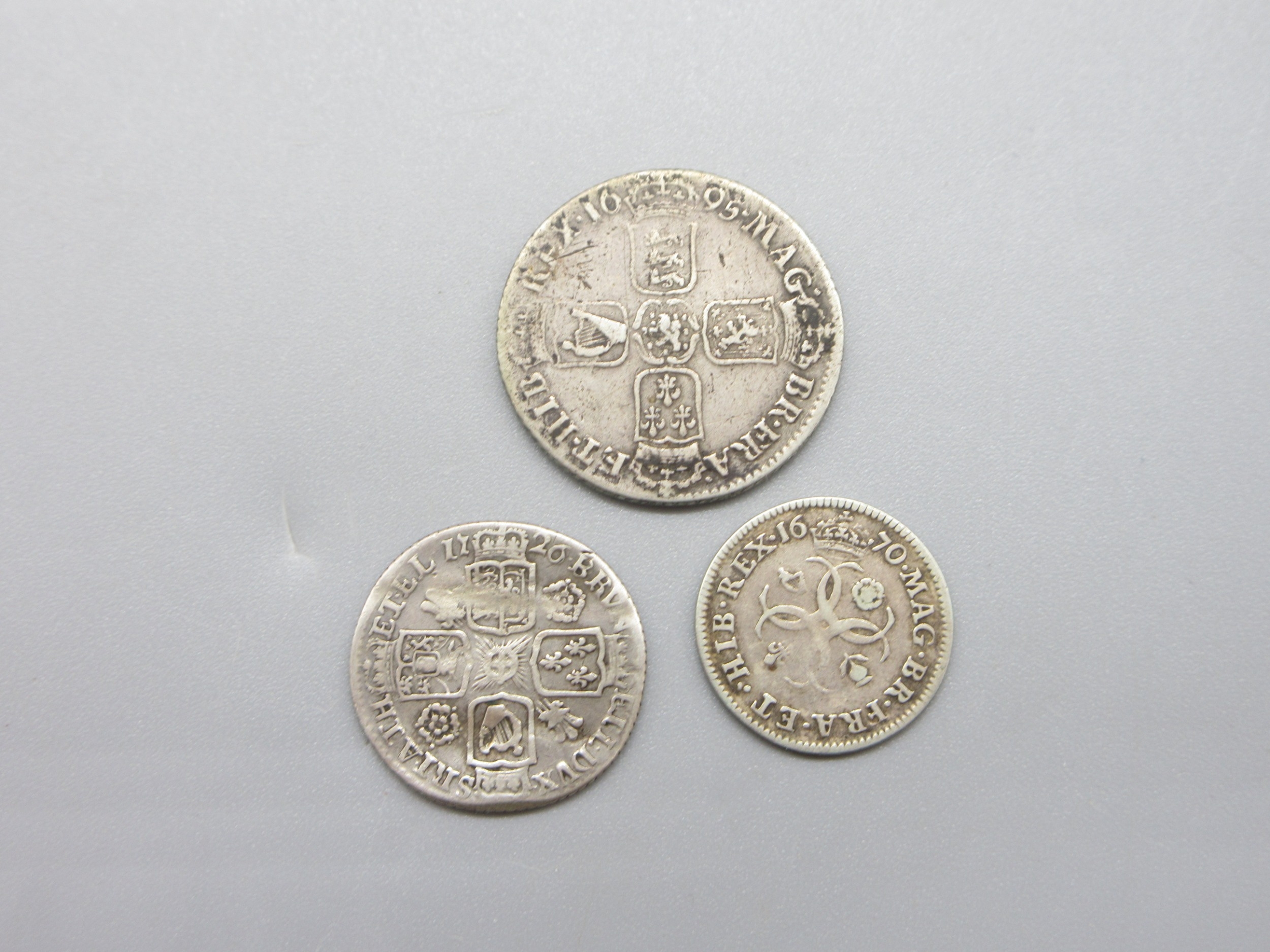Charles II 1670 four pence, William III 1695 Shilling and a George I ...