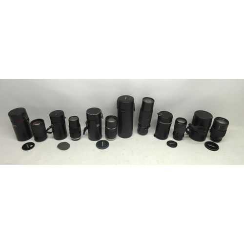 Six camera lenses in leather cases; Tamron 1:3.5 200mm, Sigma Zoom 1:5 ...