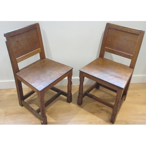 Robert Mouseman Thompson of Kilburn - a pair of oak dining chairs ...