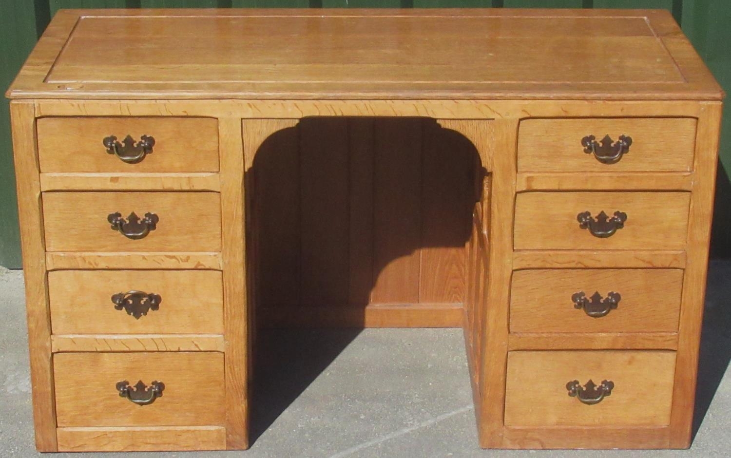 Derek Fishman Slater of Crayke - an oak kneehole desk, moulded top with ...