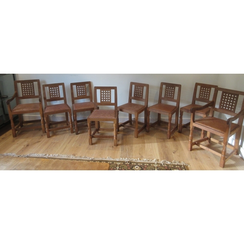 Robert Mouseman Thompson of Kilburn - a set of eight oak dining chairs ...