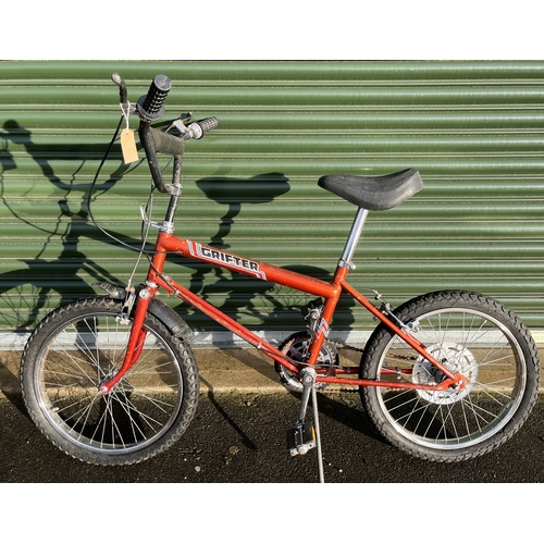 Orange Raleigh Grifter bicycle