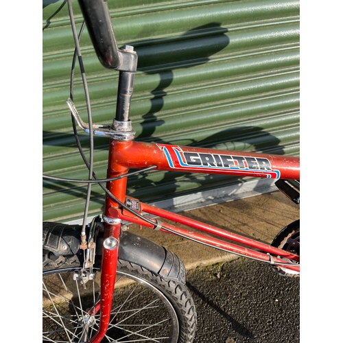 Orange Raleigh Grifter bicycle