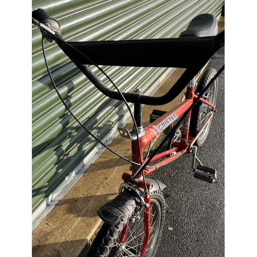 Orange Raleigh Grifter bicycle