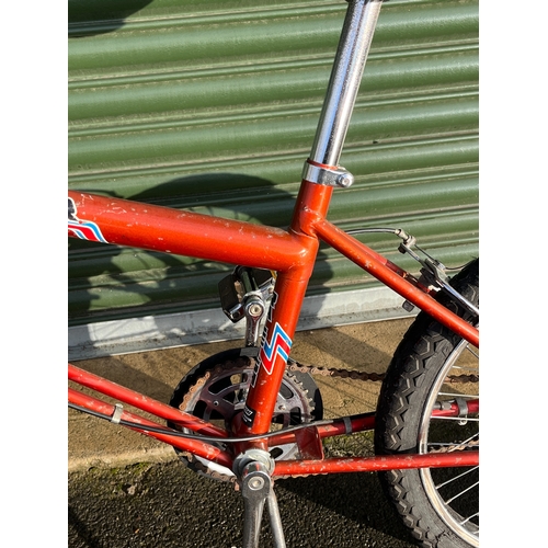 Orange Raleigh Grifter bicycle