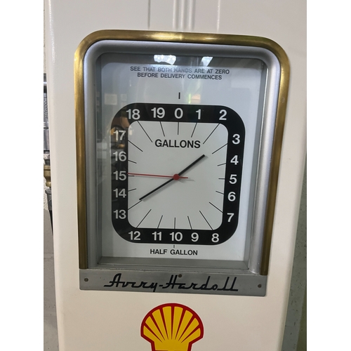 Petrol pump storage unit with inset clock, topped with Shell globe ...