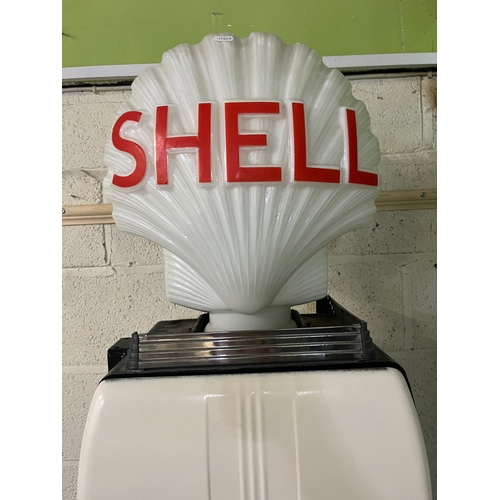 Petrol pump storage unit with inset clock, topped with Shell globe ...