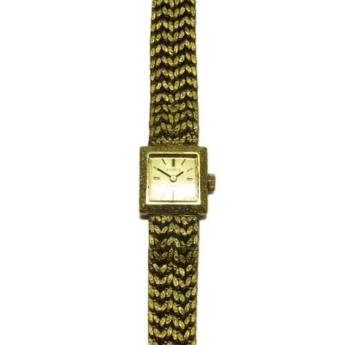 Everite ladies gold plated wristwatch on integrated bark effect ...