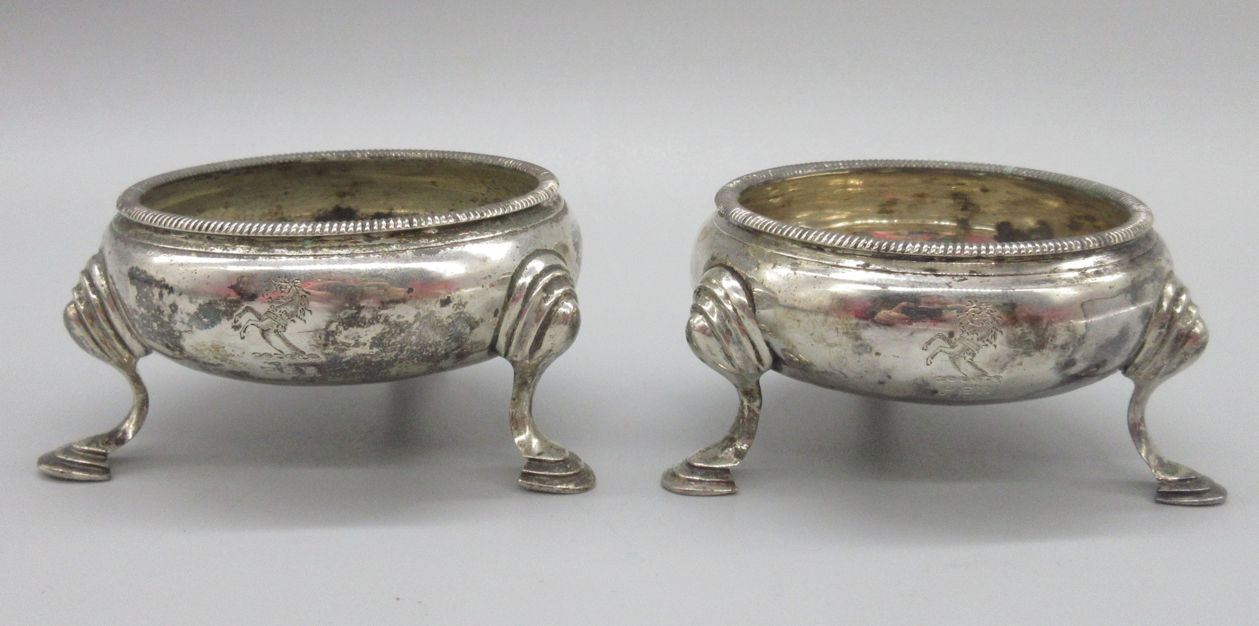 George II silver pair of salts with gadrooned border and raised on ...