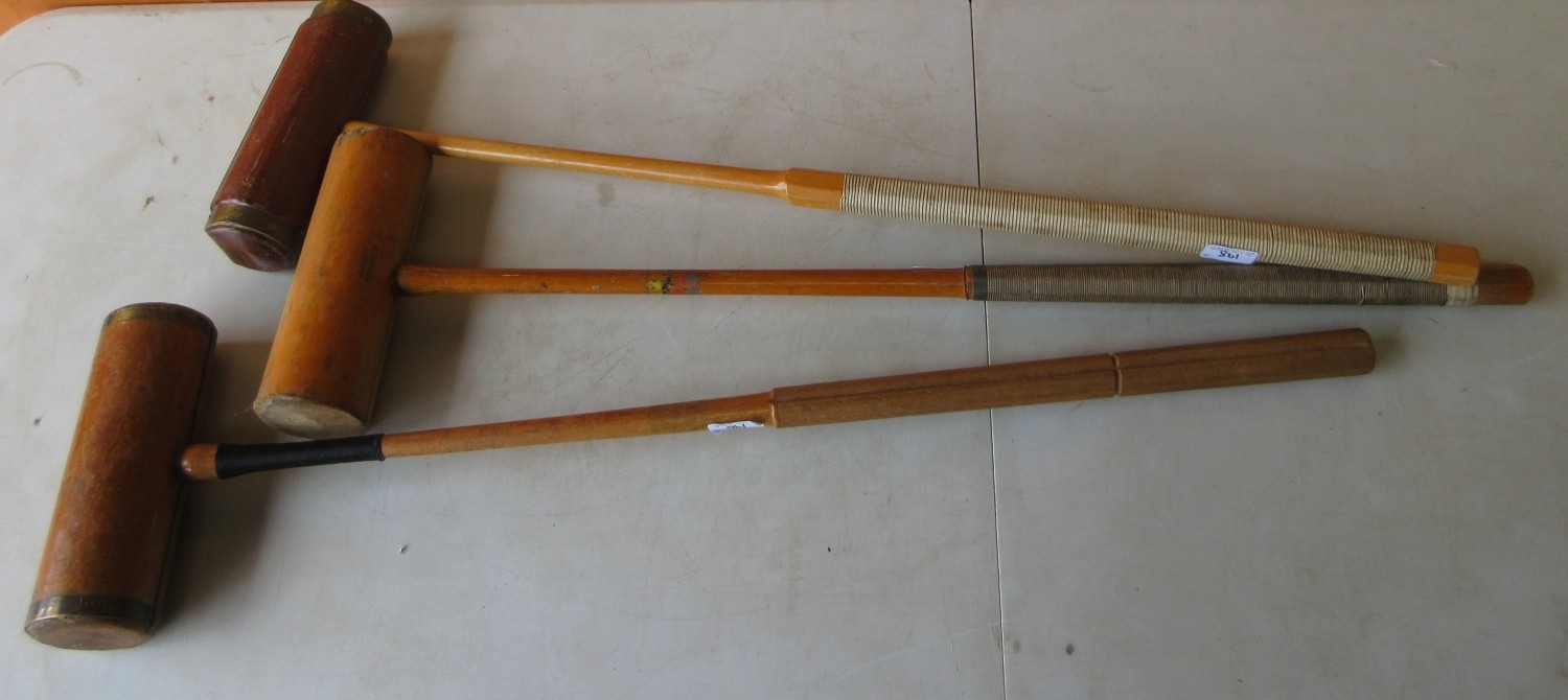 Two F. H. Ayres London croquet mallets and one other croquet mallet ...