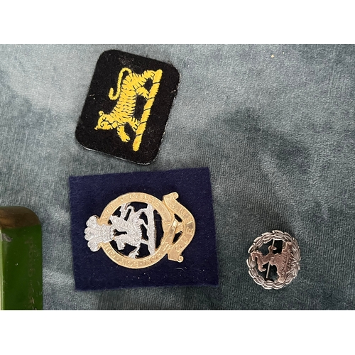 Box of various Kent Buffs and regiments badges including gold on silver ...