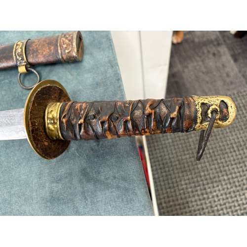 Samurai style Wakizashi, steel blade. Leather tsuba with two menuki ...