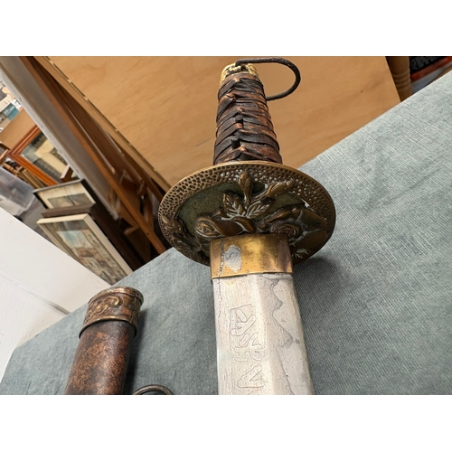 Samurai style Wakizashi, steel blade. Leather tsuba with two menuki ...