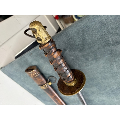 Samurai style Wakizashi, steel blade. Leather tsuba with two menuki ...